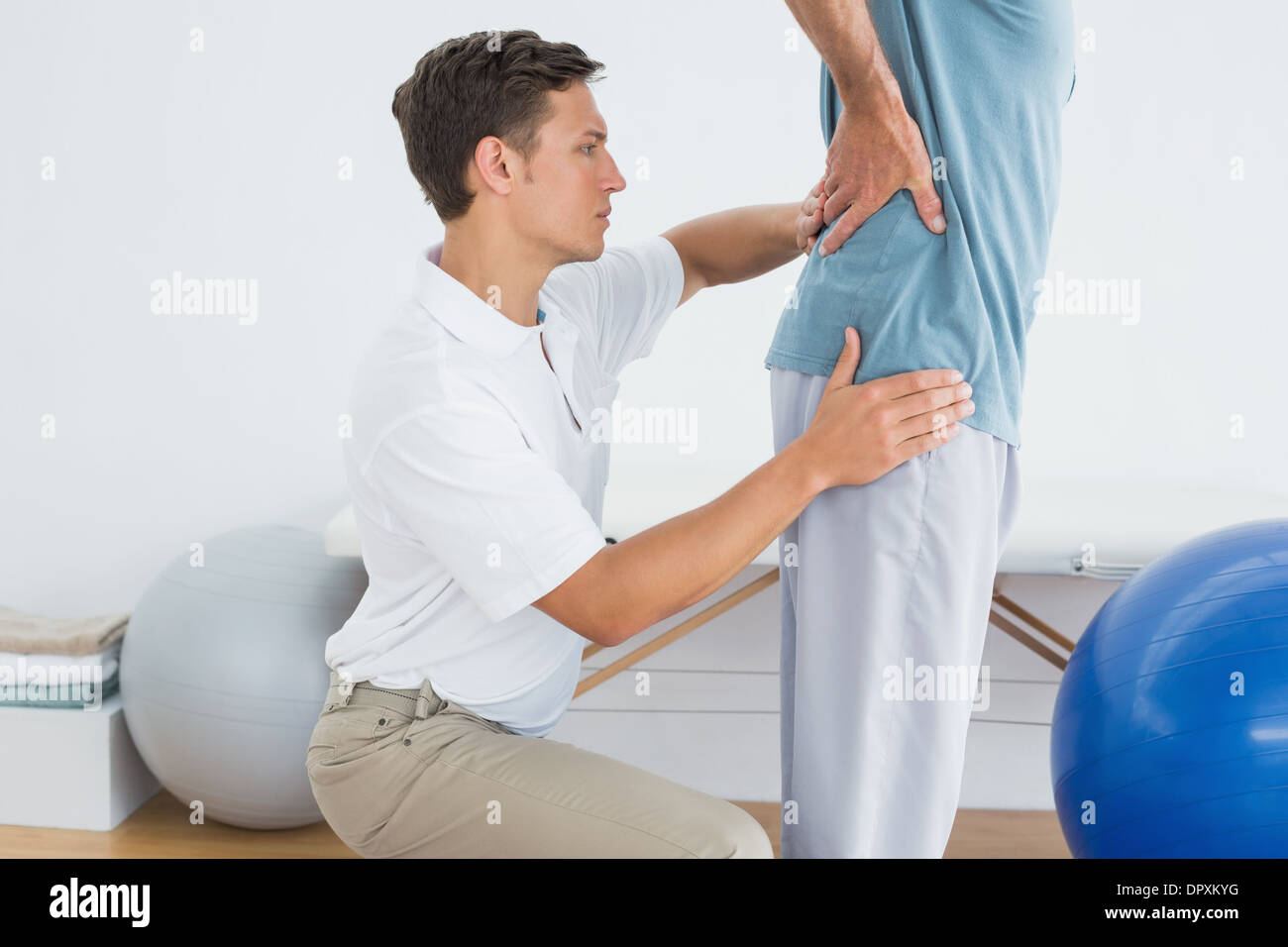 Lower back massage hi-res stock photography and images - Alamy