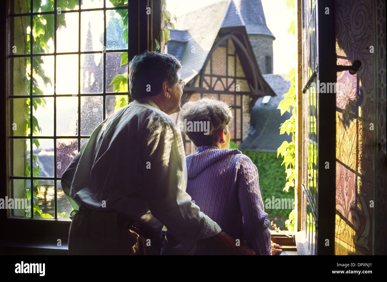 Looking through stained glass window hi-res stock photography and ...