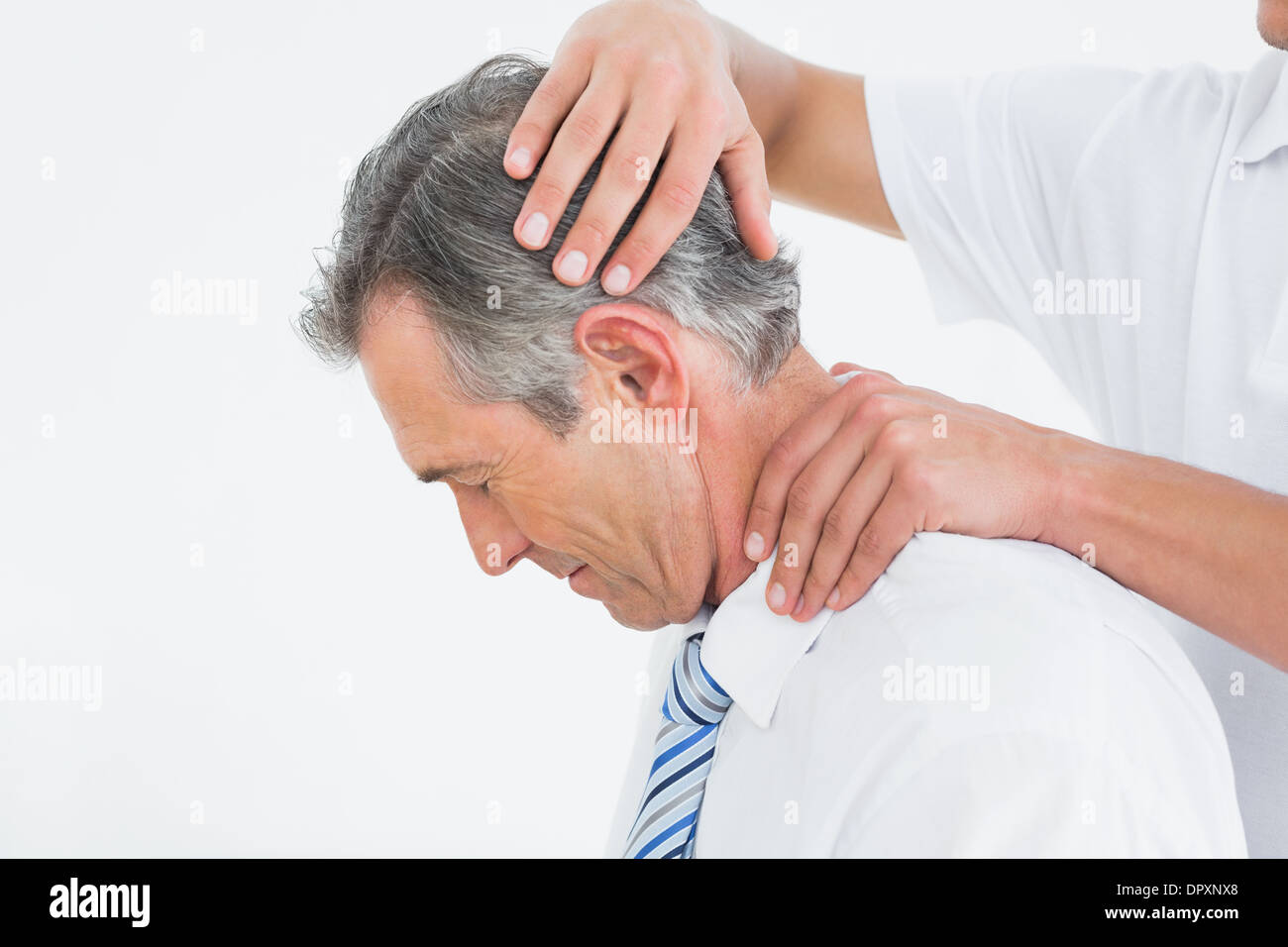 Chiropractor doing neck adjustment Stock Photo - Alamy