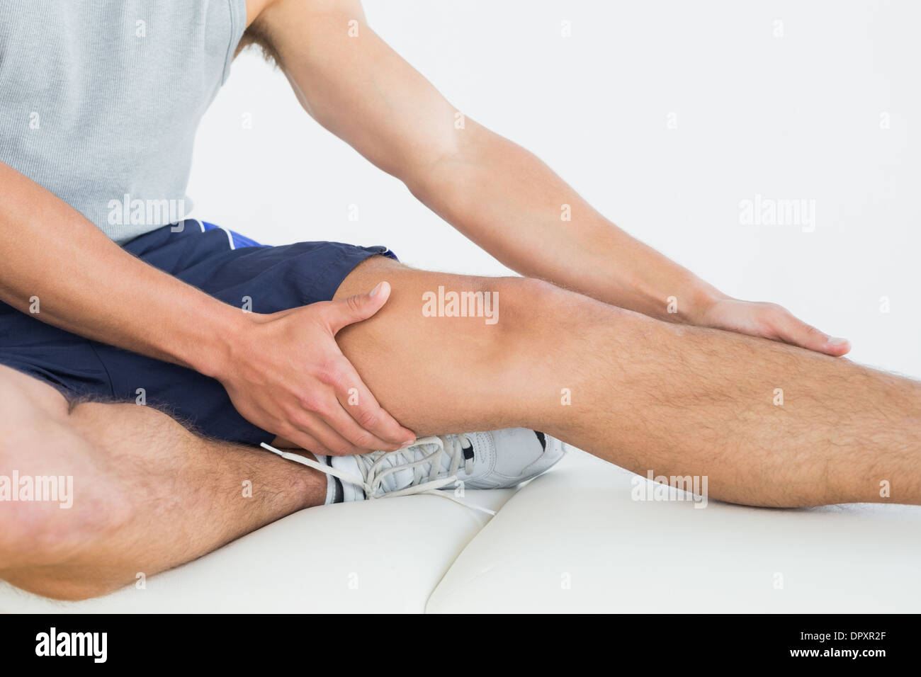 Hands to leg hi-res stock photography and images - Alamy