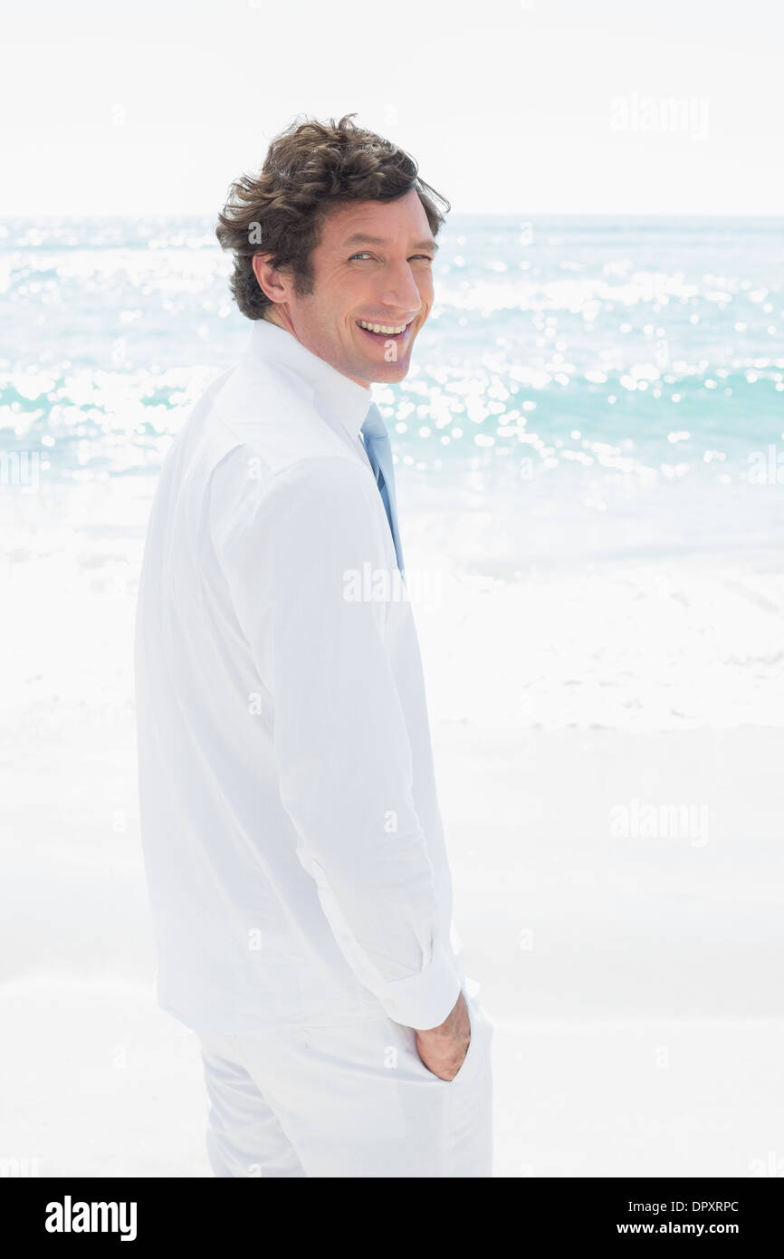 Handsome groom looking over his shoulder to camera Stock Photo - Alamy