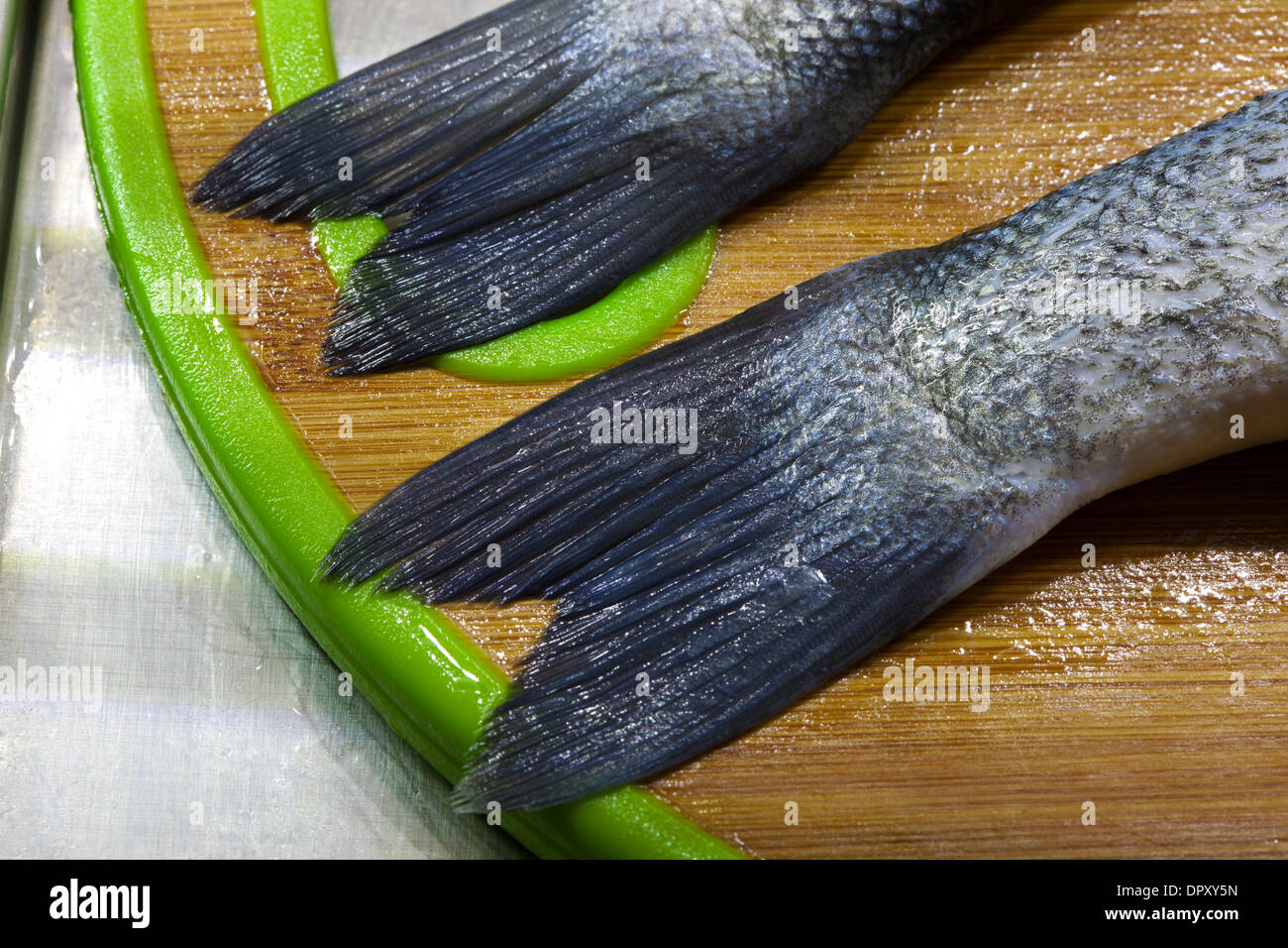 Fish tails at cooking Stock Photo - Alamy