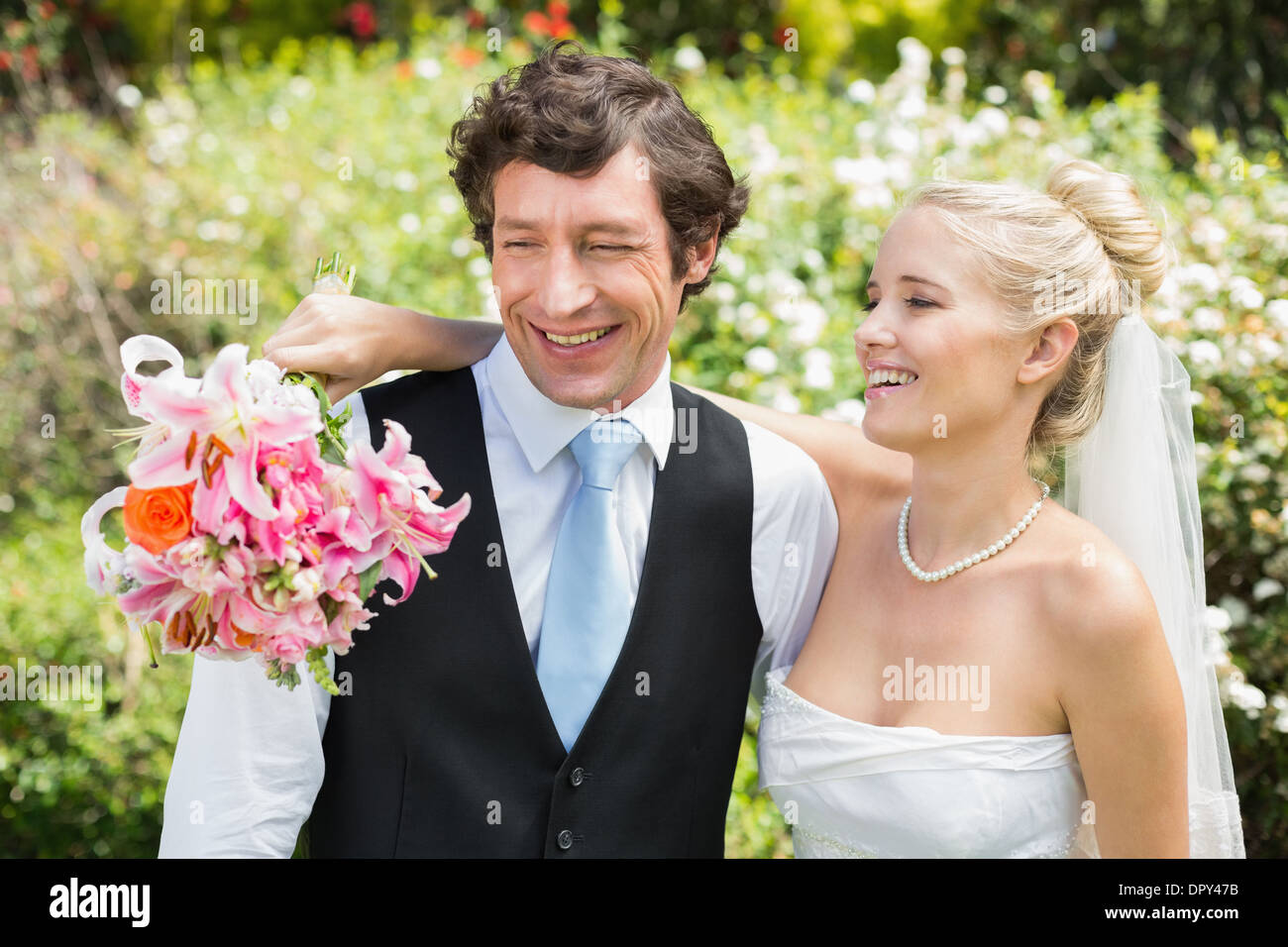 Romantic newlywed couple smiling on their wedding day Stock Photo - Alamy
