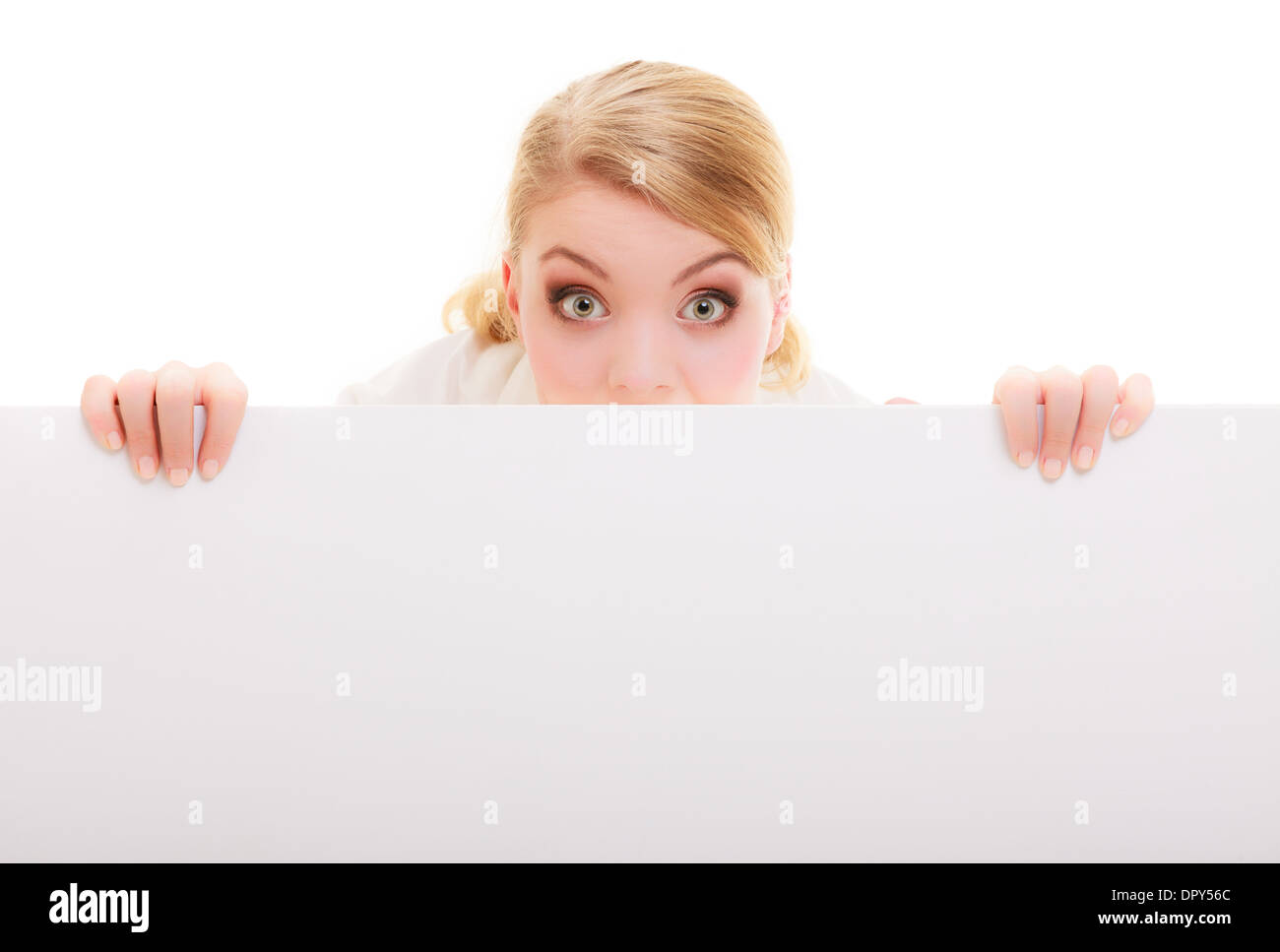 Businesswoman funny wide eyed peeking looking over sign. Girl with ...