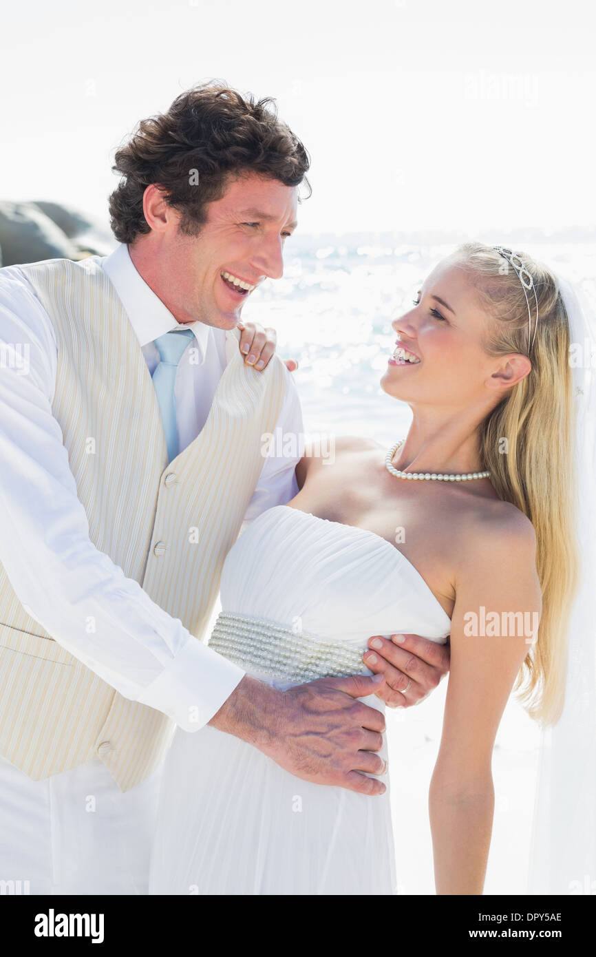 Groom dipping his smiling new wife while dancing Stock Photo - Alamy