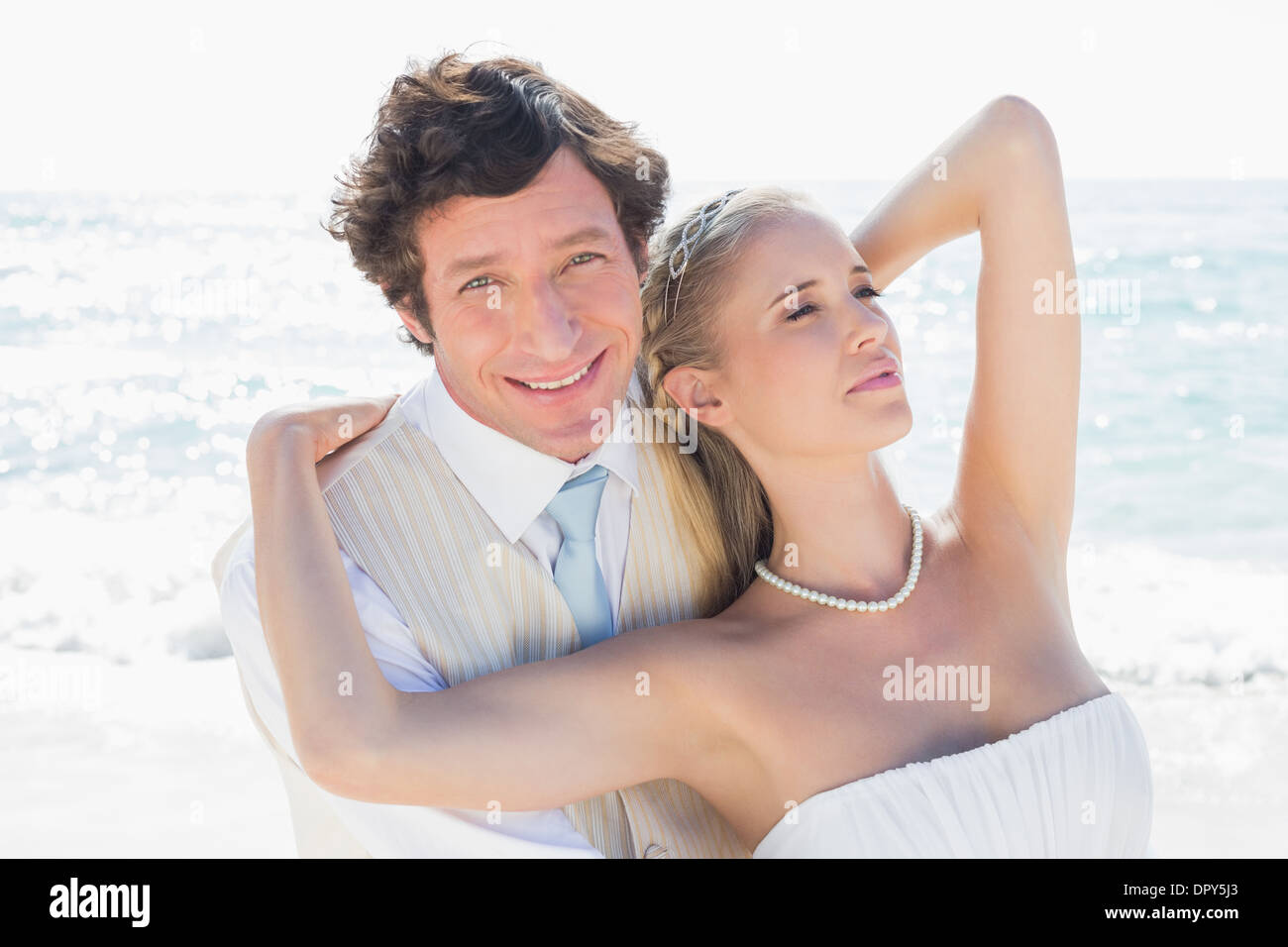 Bride groom embracing beach portrait hi-res stock photography and ...