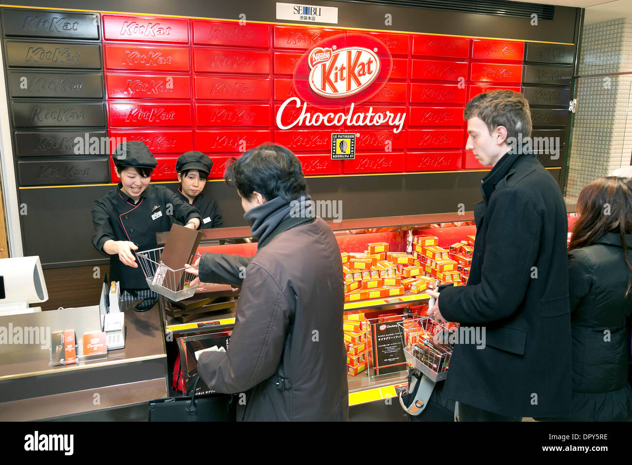Tokyo, Japan. 17th January 2014. Customers buy the first limited ...