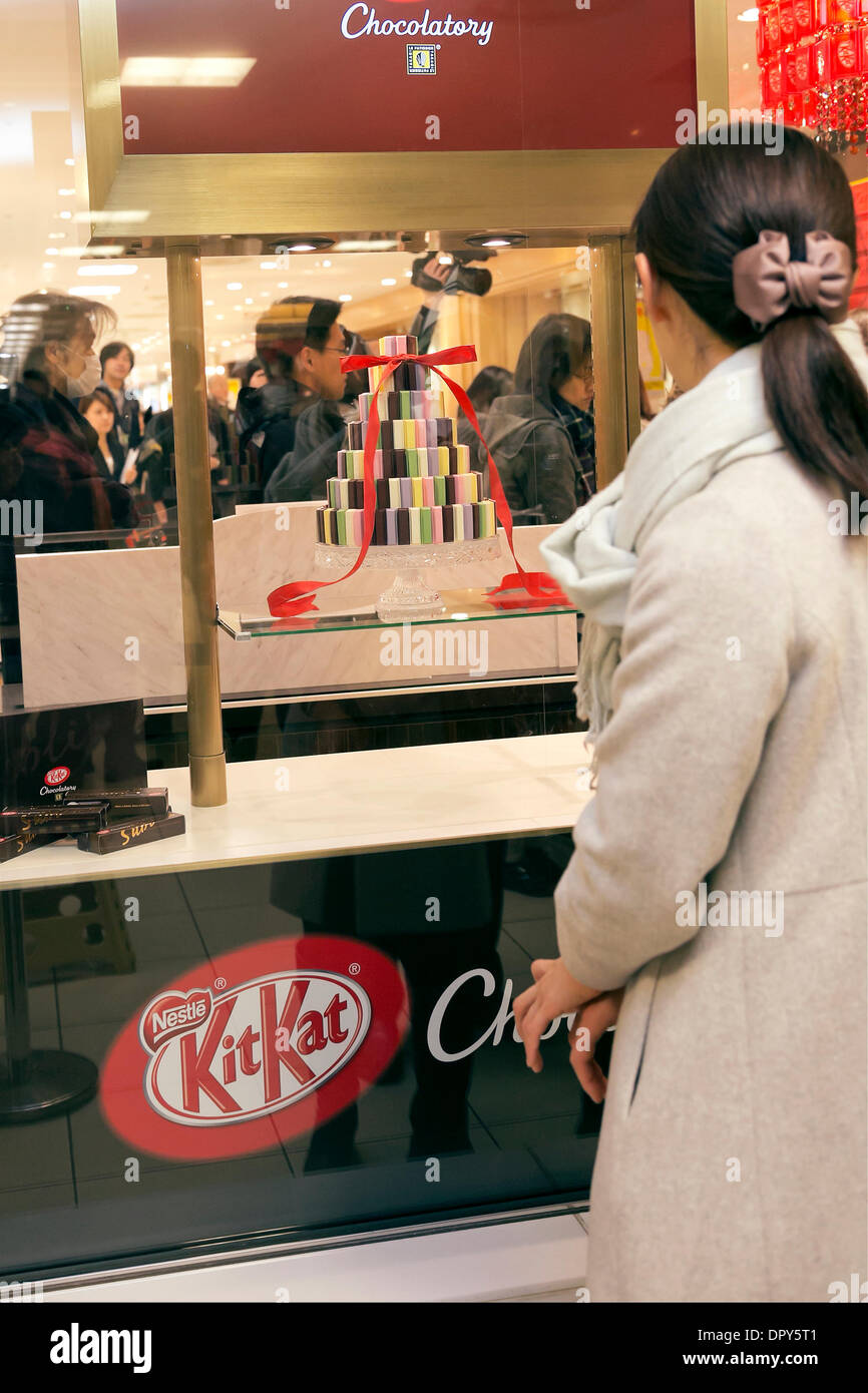 Tokyo, Japan. 17th January 2014. A fan of Kit Kat products waits ...