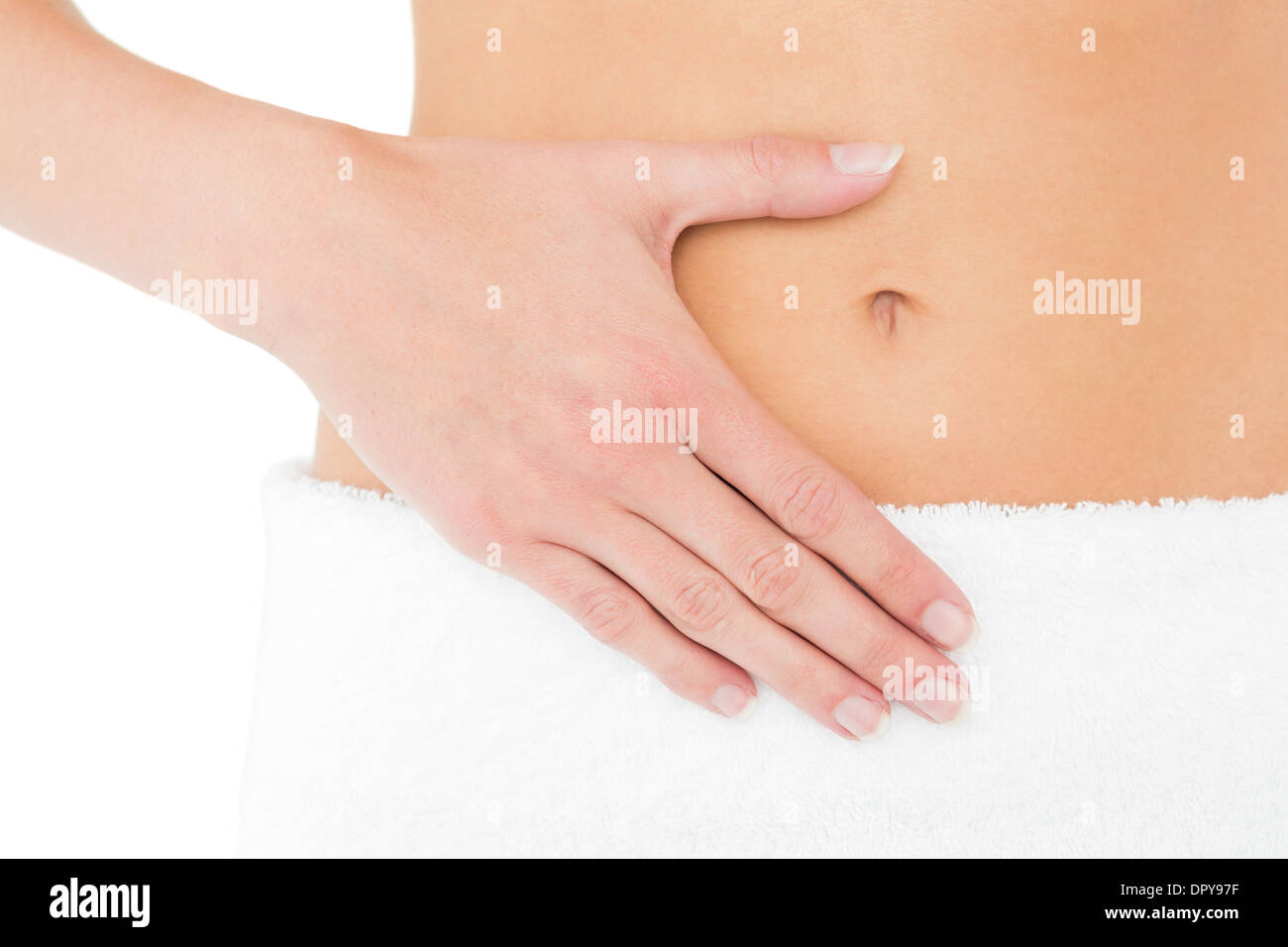 Mid section of a fit woman with hand on stomach Stock Photo - Alamy