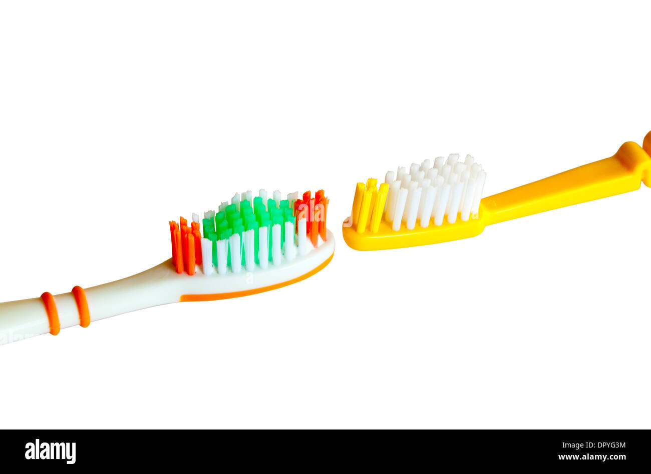 closeup detail of isolated colored toothbrushes on white with copy ...
