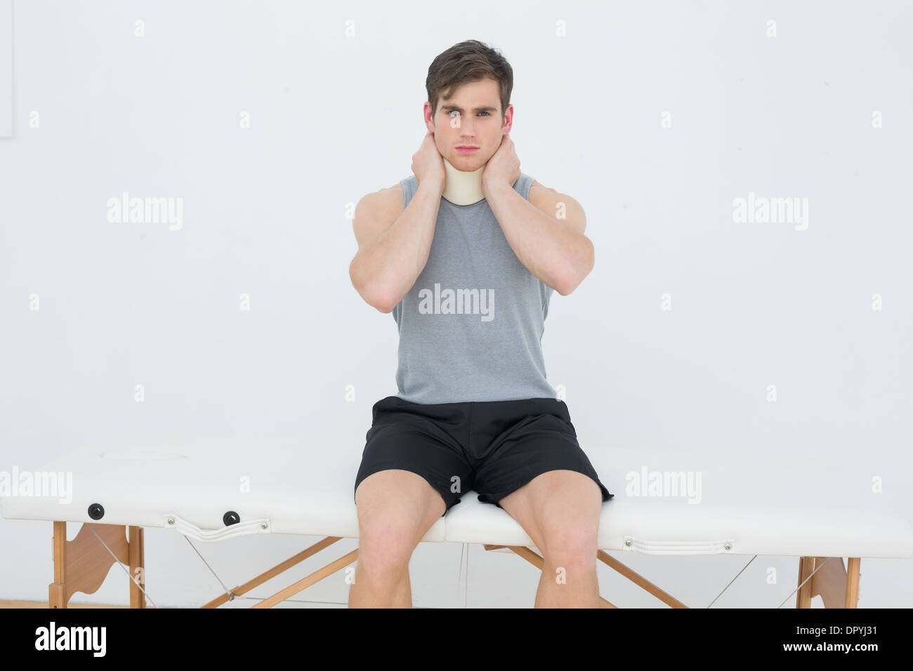Portrait of a handsome young man wearing cervical collar Stock Photo ...