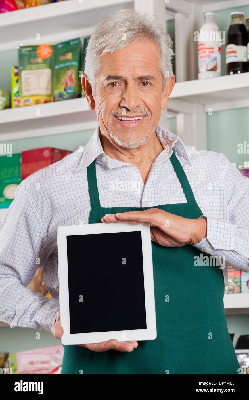 Senior male owner showing hi-res stock photography and images - Alamy