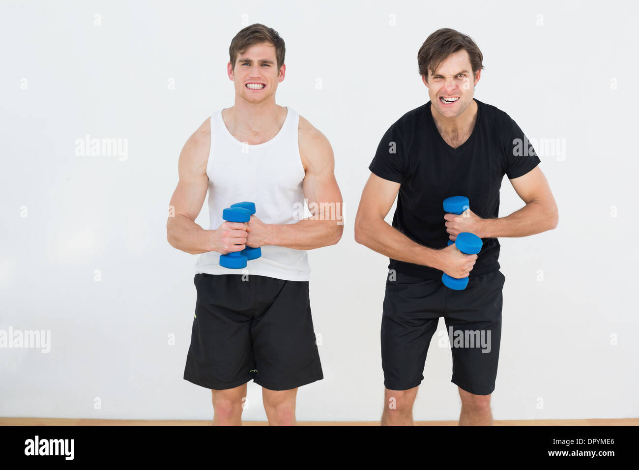 Two muscular men flexing biceps hi-res stock photography and images - Alamy