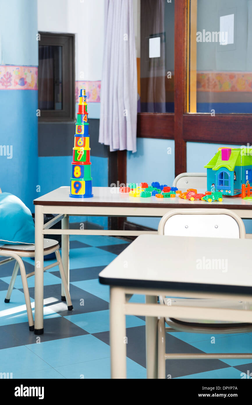 Colorful Construction Blocks And House On Desk Stock Photo - Alamy