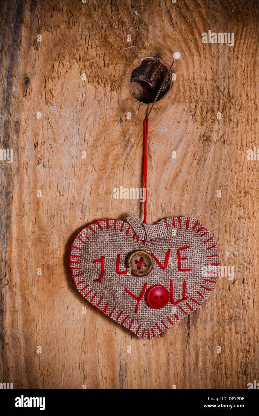 Valentine background with hand-sewn heart with word I love You on ...