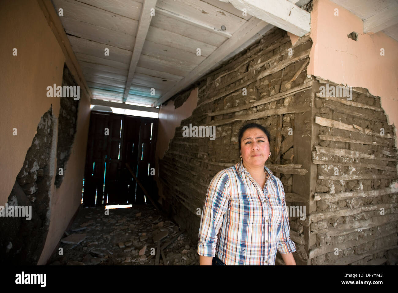 Ana Victoria Siguenza in San Marcos stands in her house that was ...