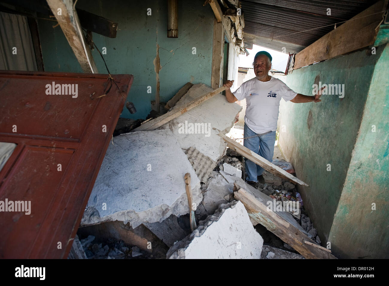 Resident of San Marcos department in Guatemala shows his destroyed ...