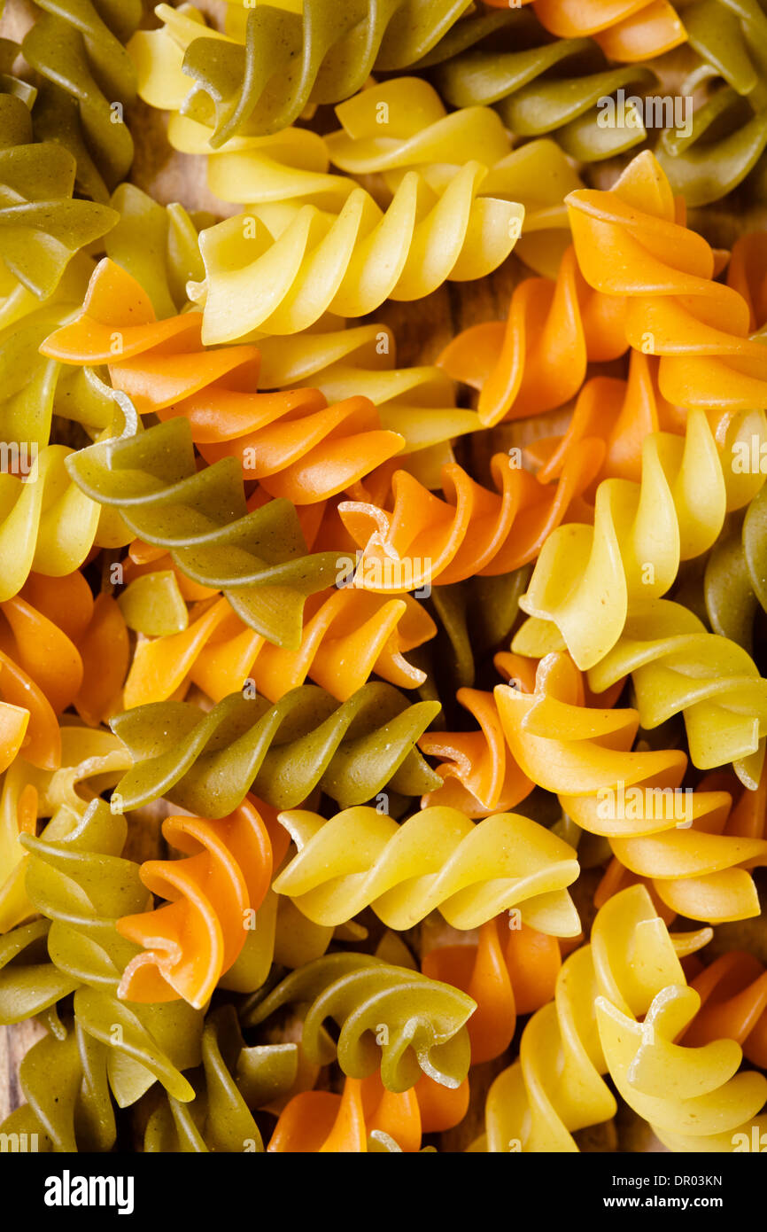 Italian raw pasta - fusilli background closeup Stock Photo - Alamy