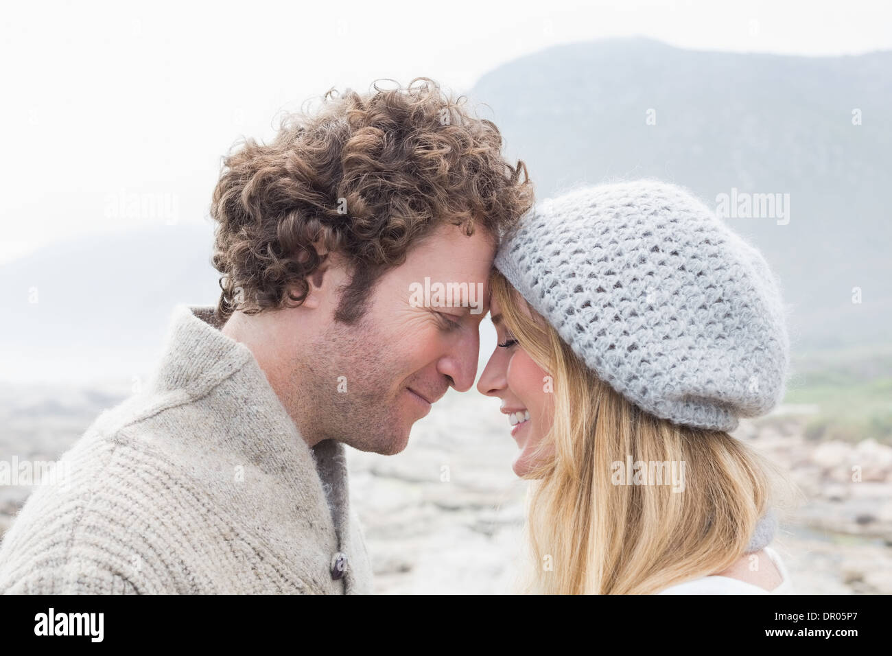 Close-up side view of a romantic young couple together Stock Photo - Alamy