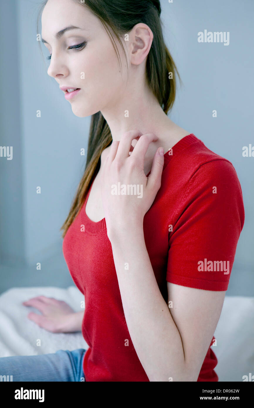 Woman itching neck hi-res stock photography and images - Alamy