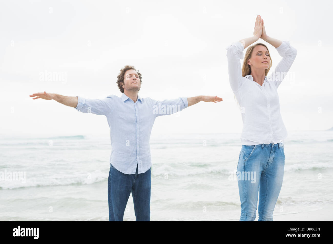 Peaceful couple with eyes closed at beach Stock Photo - Alamy