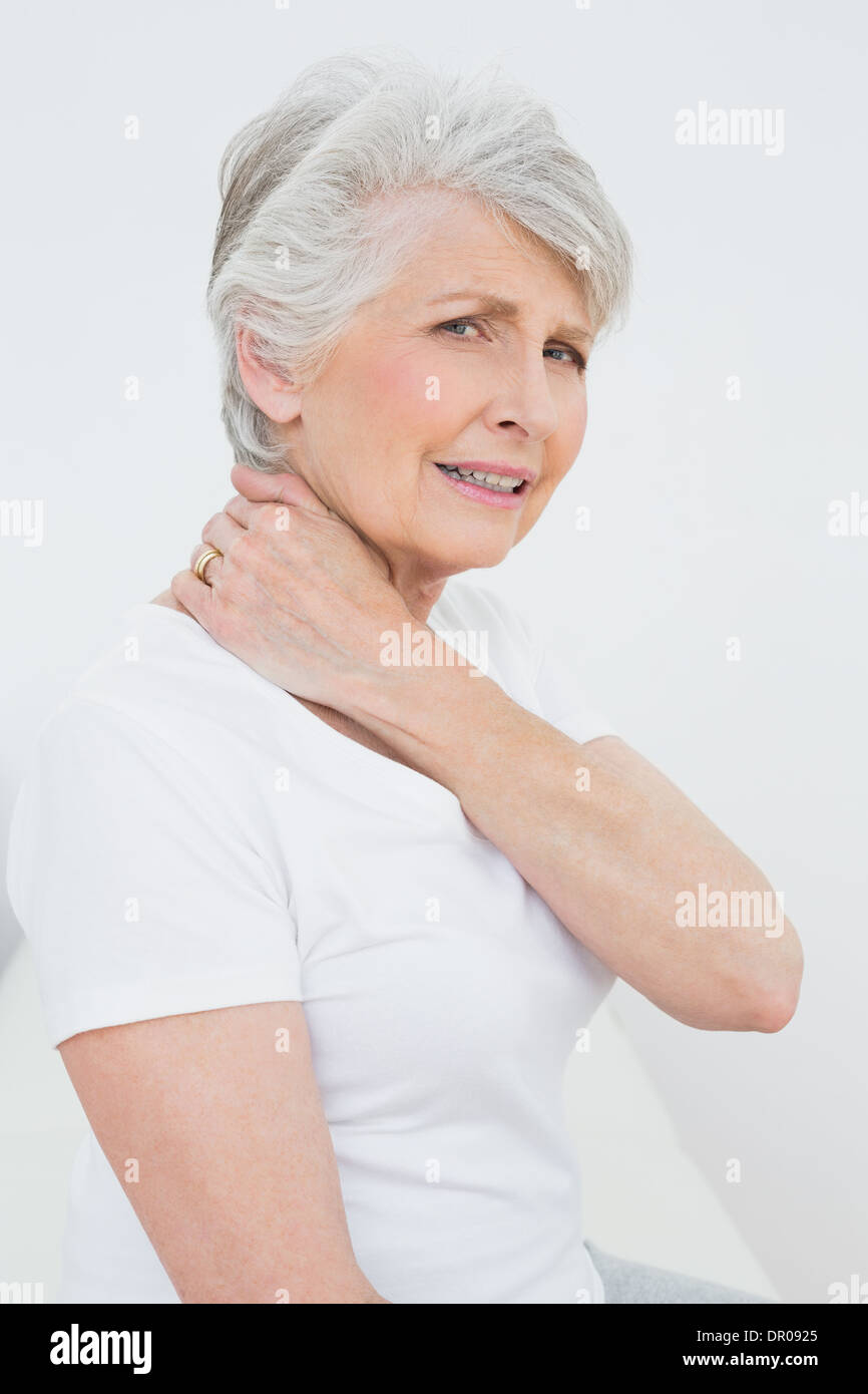 Side view portrait of a senior woman suffering from neck pain Stock ...