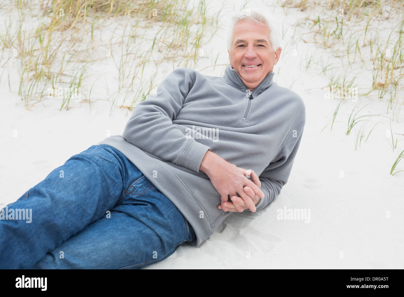 Man relaxing on beach hi-res stock photography and images - Alamy