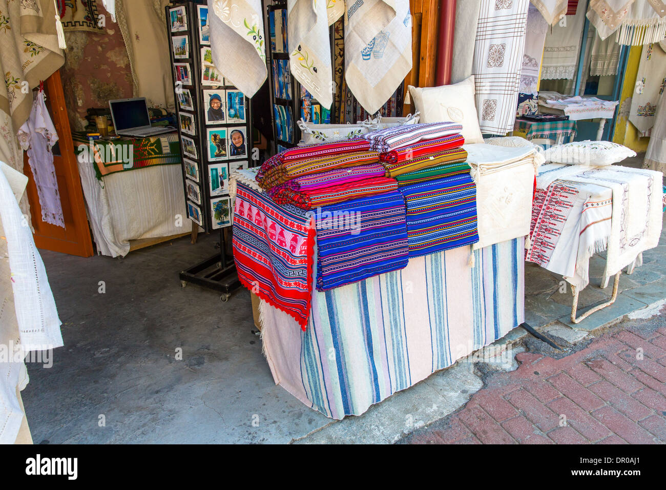 Traditional textiles on a market stall, colorful fabric, handmade ...