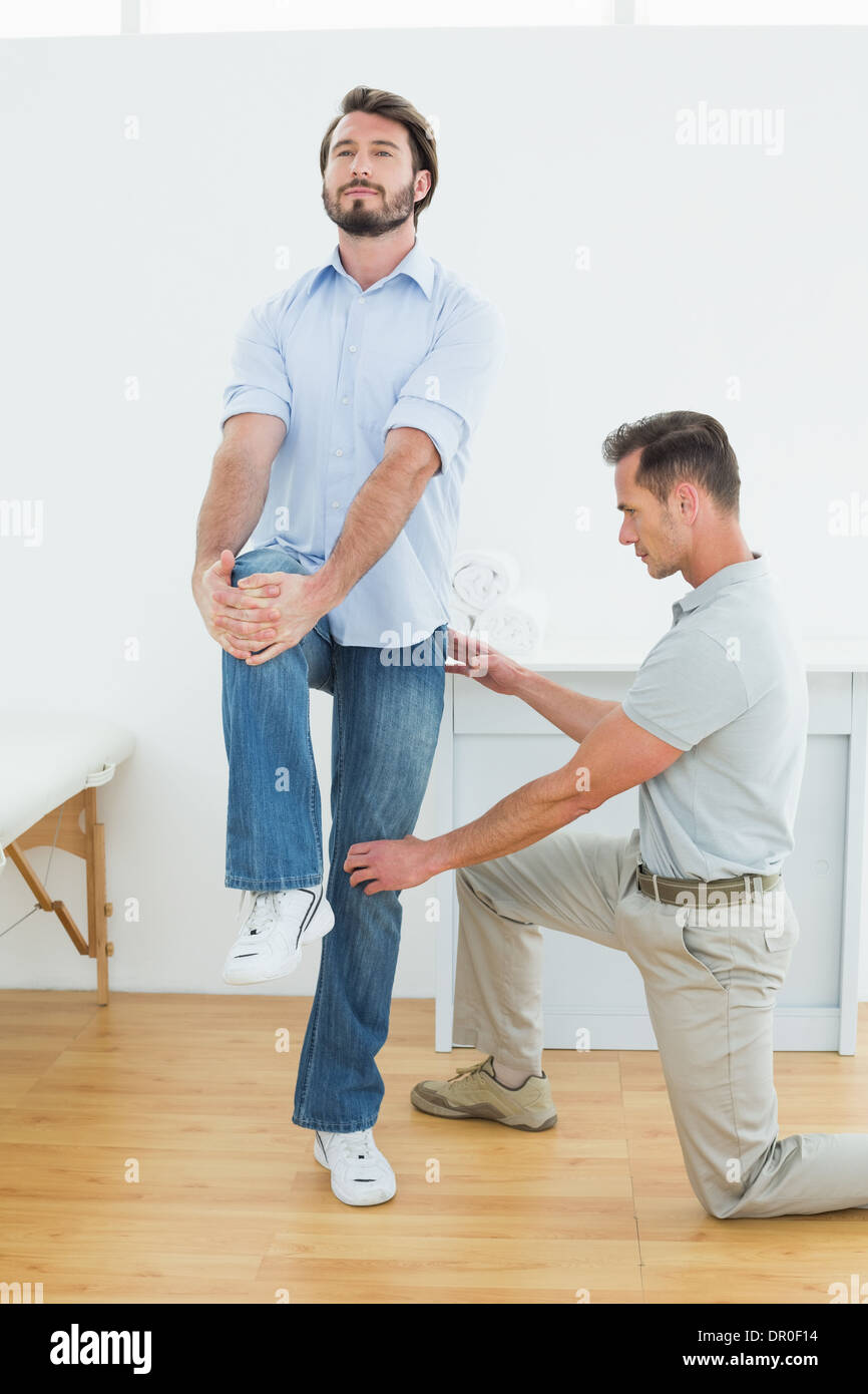 Man stretching office hi-res stock photography and images - Alamy