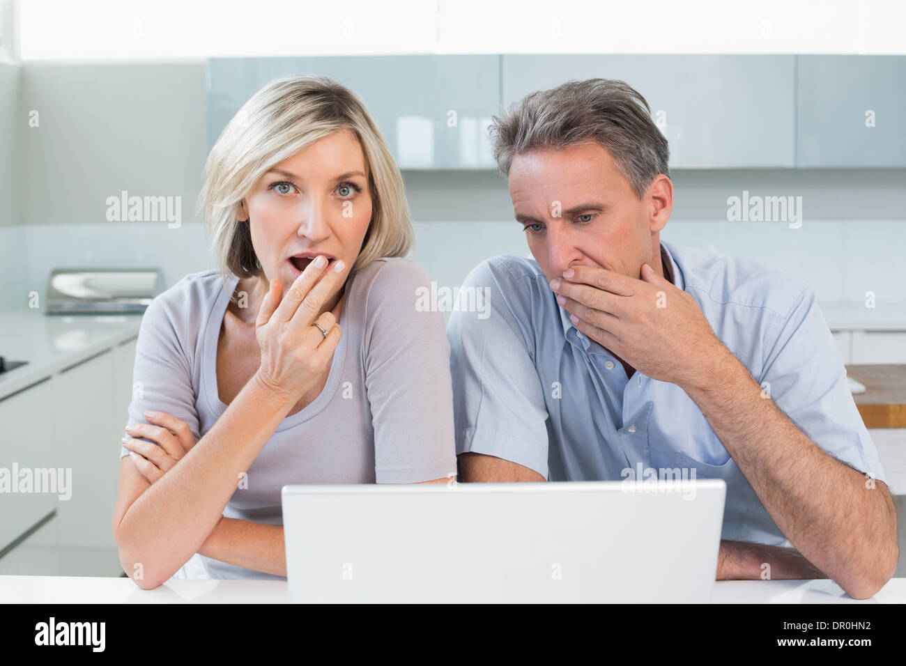 Shocked mature woman using hi-res stock photography and images - Alamy