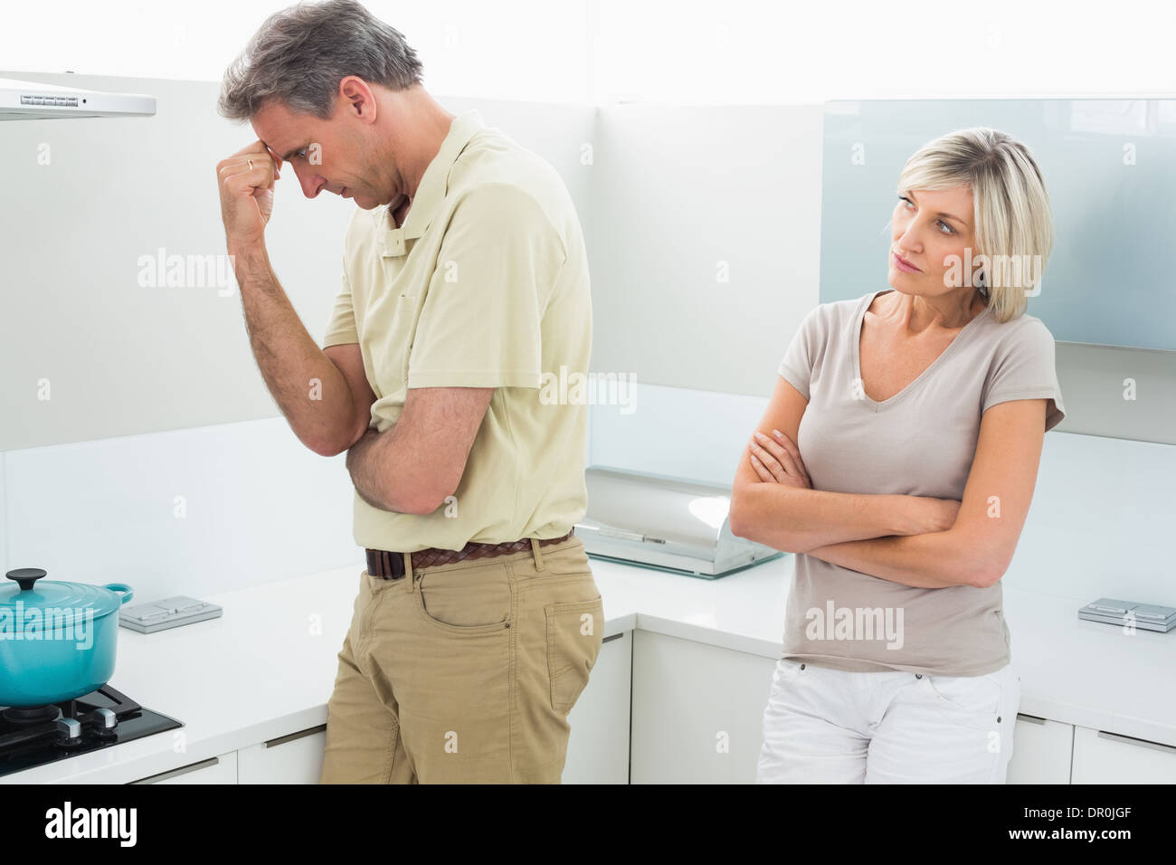 Angry couple after a fight in kitchen Stock Photo - Alamy