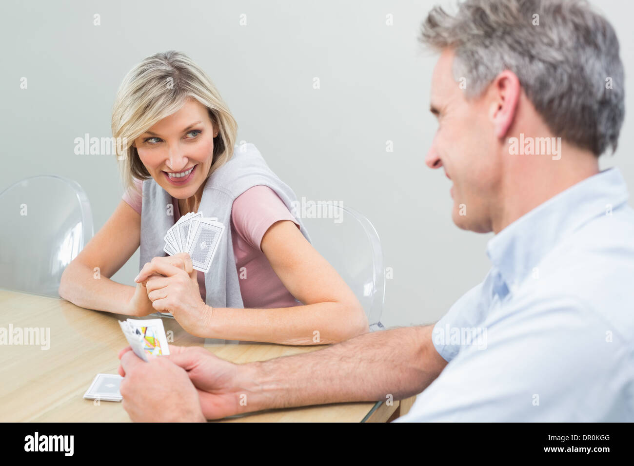 Woman looking at playing cards hi-res stock photography and images - Alamy