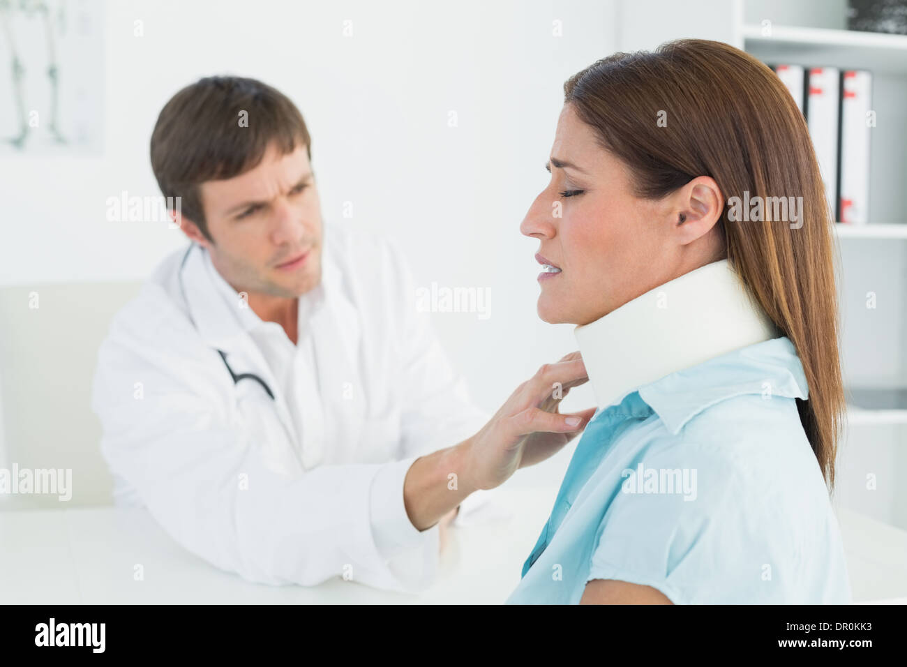 Doctor examining patient in office hi-res stock photography and images ...