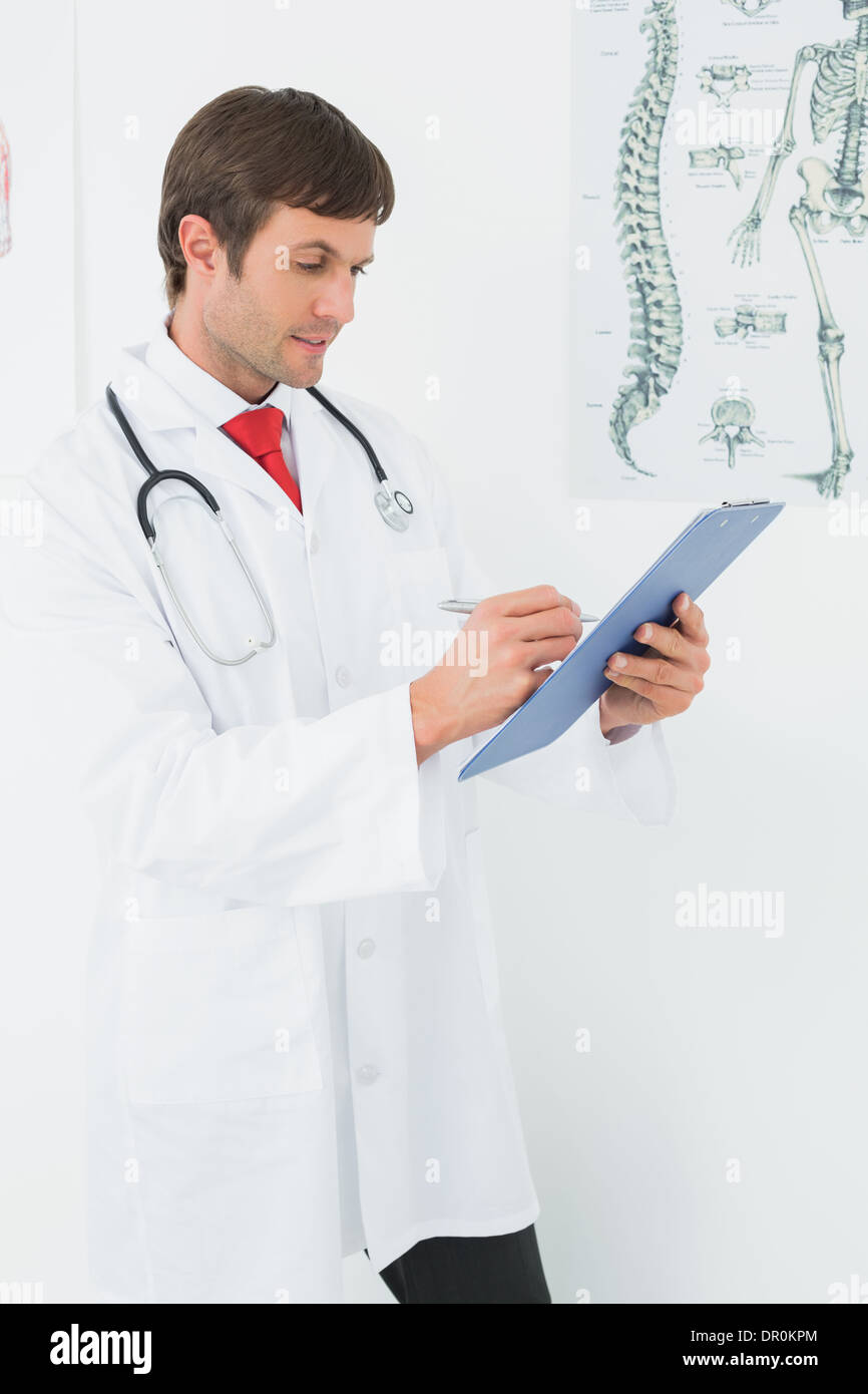 Doctor writing chart report hi-res stock photography and images - Alamy
