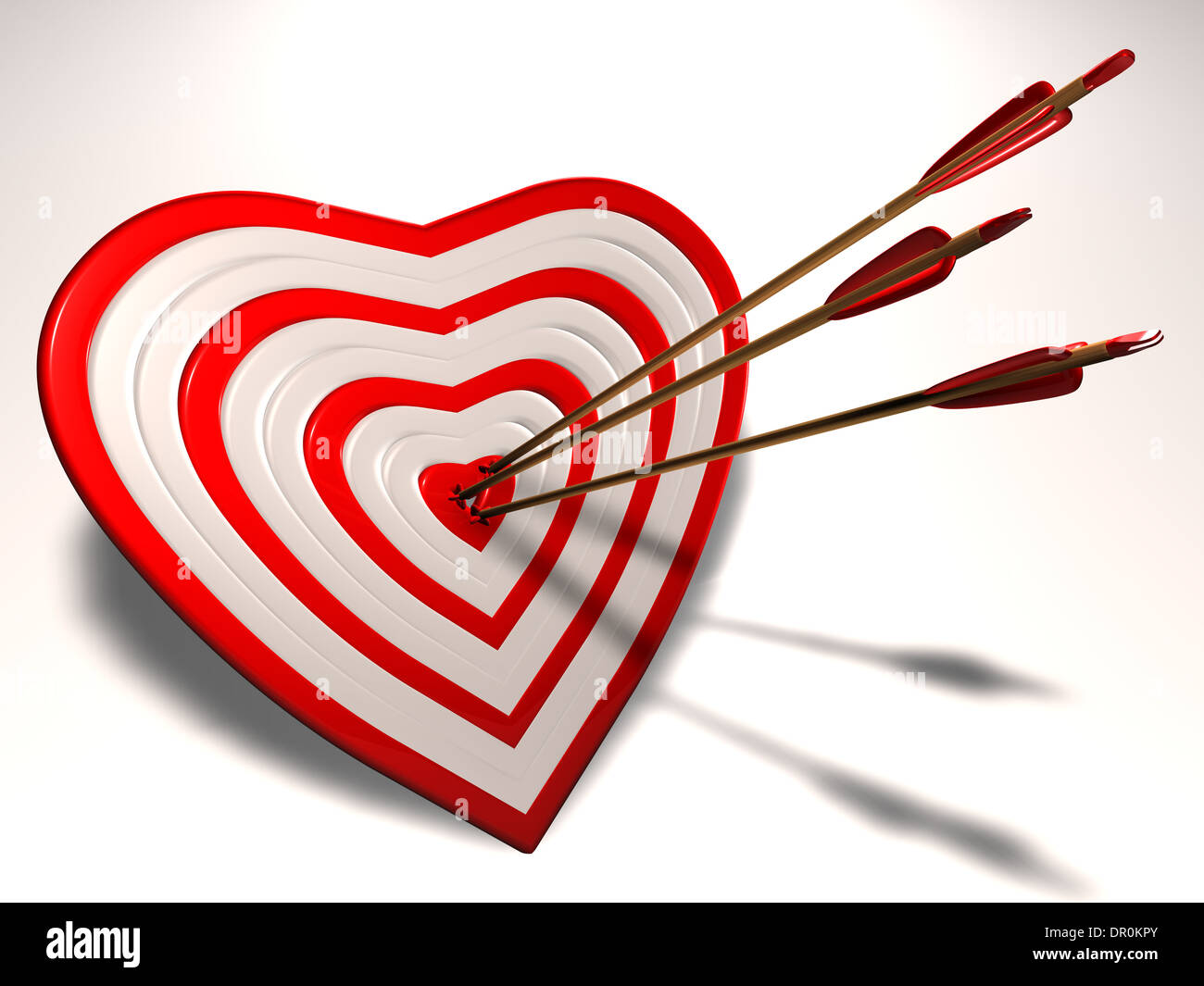 Heart shaped target with arrows in it Stock Photo - Alamy