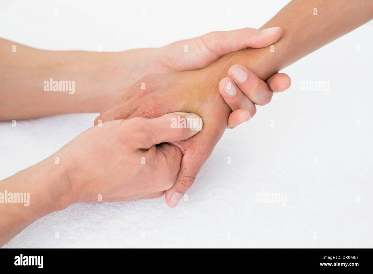 Doctor examining a female patients hand Stock Photo - Alamy