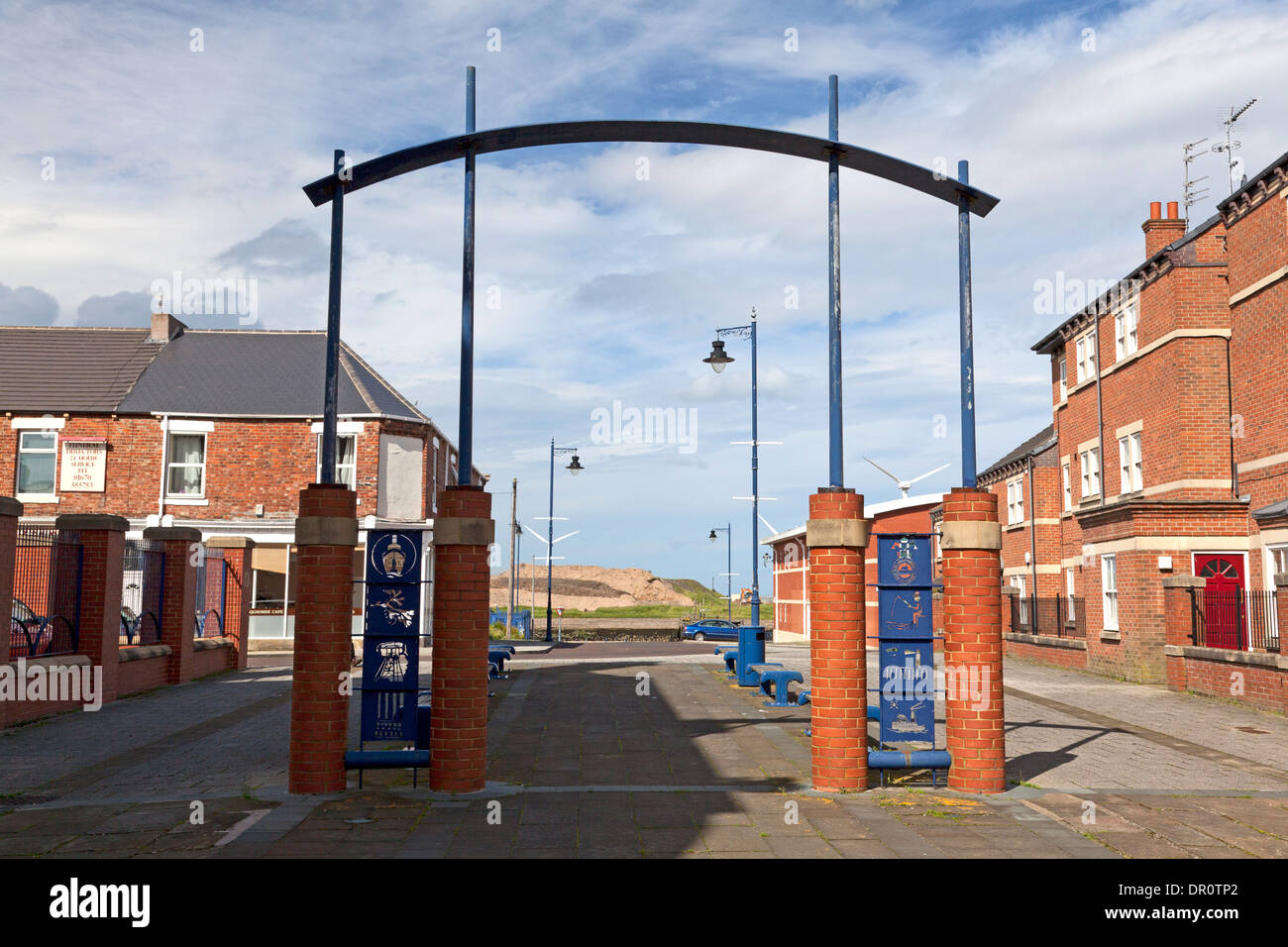 Archway in front of apartment buildings on the dockside, Blyth ...