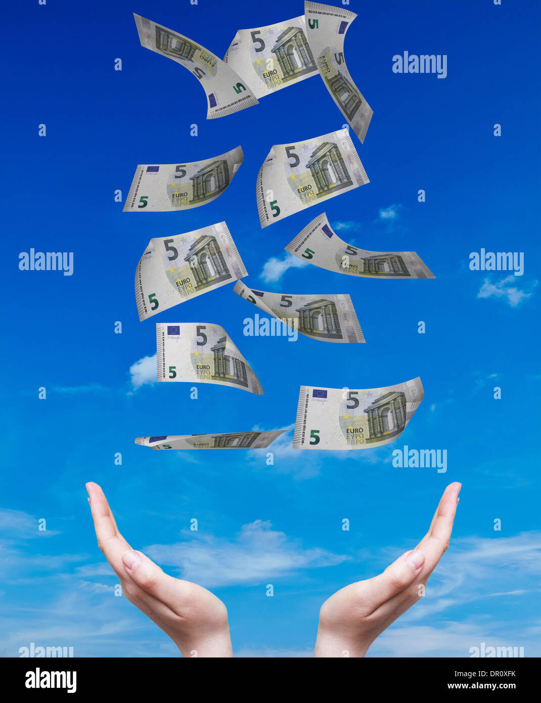 Woman catching falling money hi-res stock photography and images - Alamy