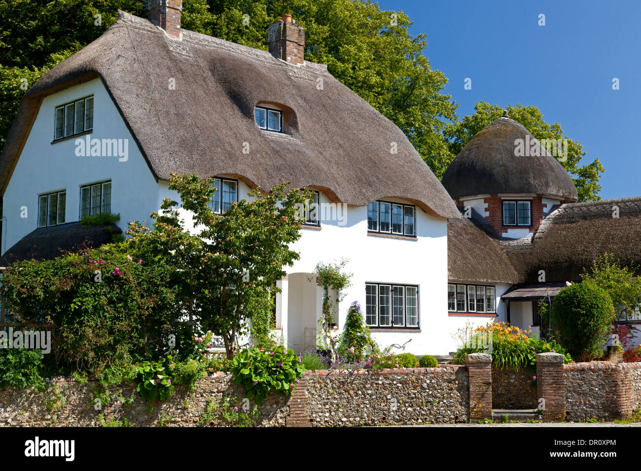 Thatched houses in the Old Dairy complex, Briantspuddle, Dorset Stock ...