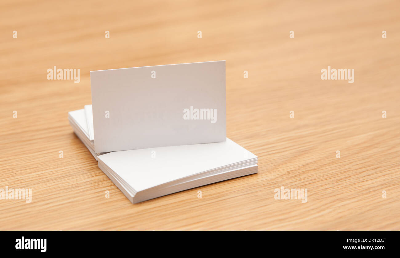 Business card pile on desk Stock Photo - Alamy