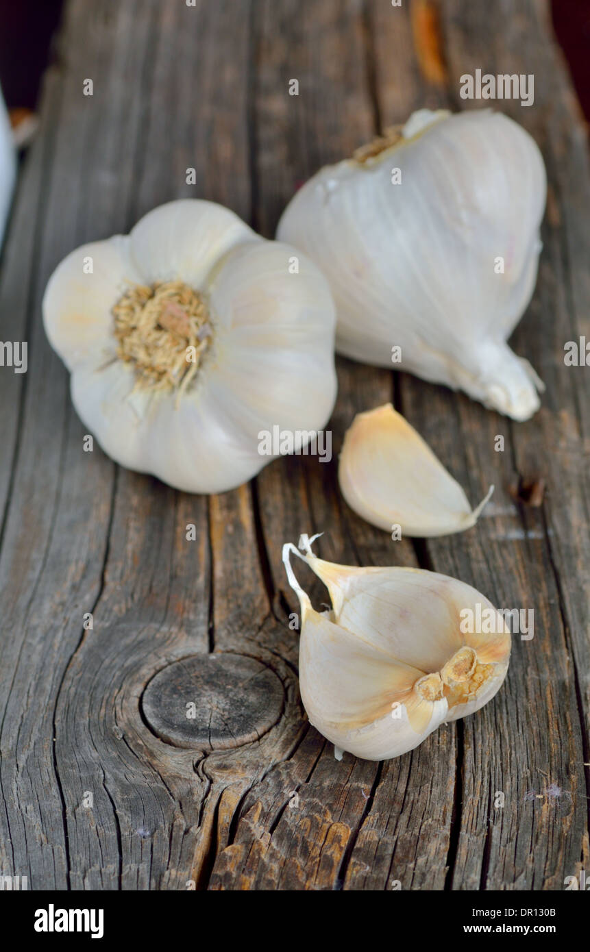 Organic garlic whole and cloves on the old wooden background Stock ...
