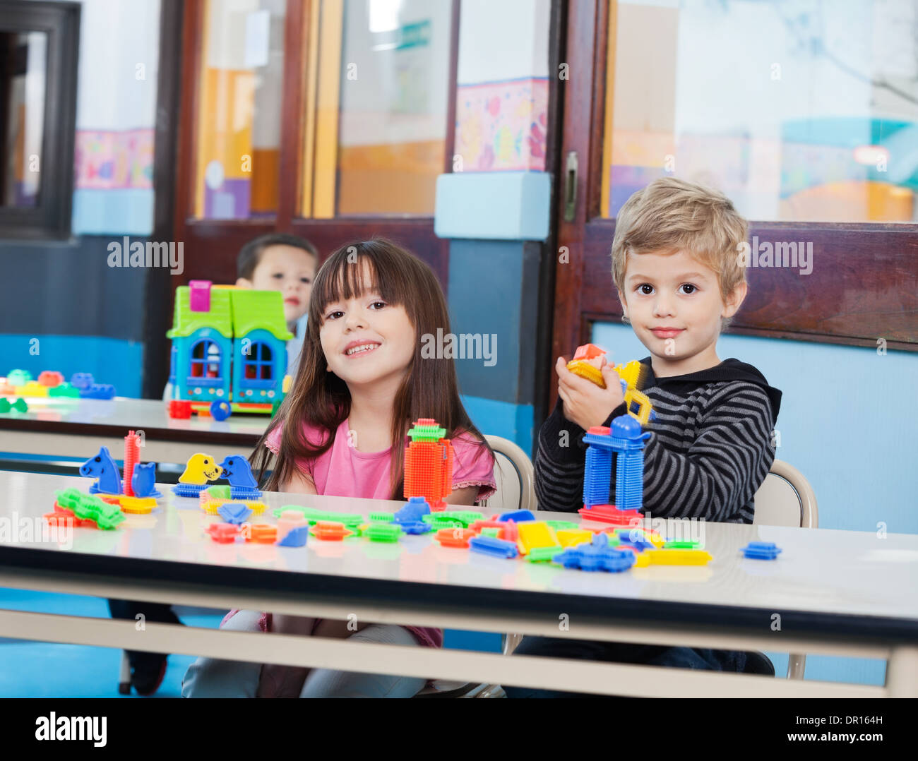 Little Children Playing With Blocks In Preschool Stock Photo - Alamy
