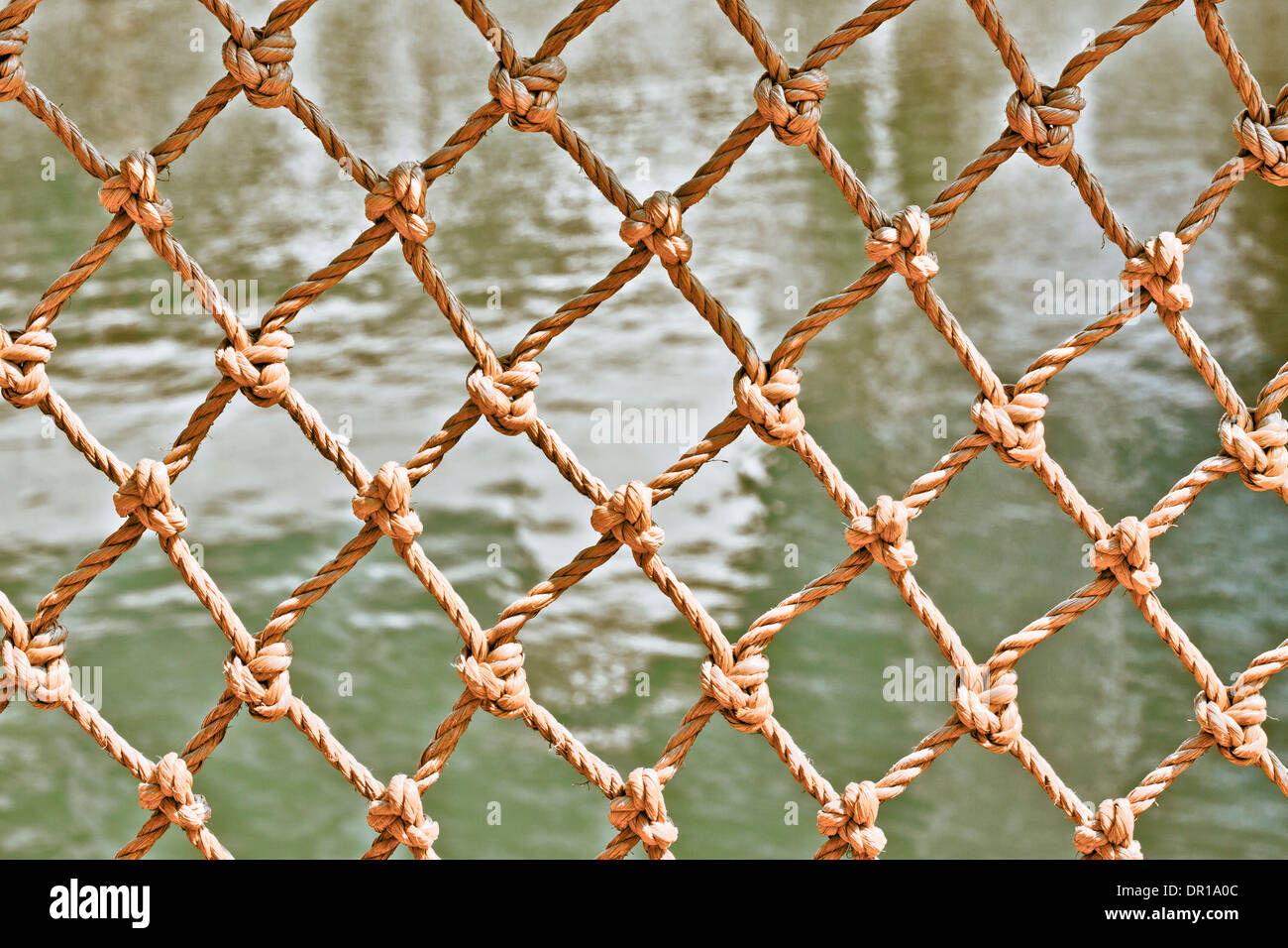 Detail of safety net over water surface Stock Photo - Alamy