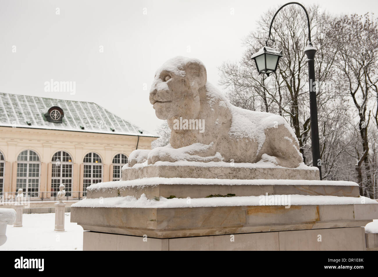 Snow on lion statue in front of Old Orangery Stock Photo - Alamy