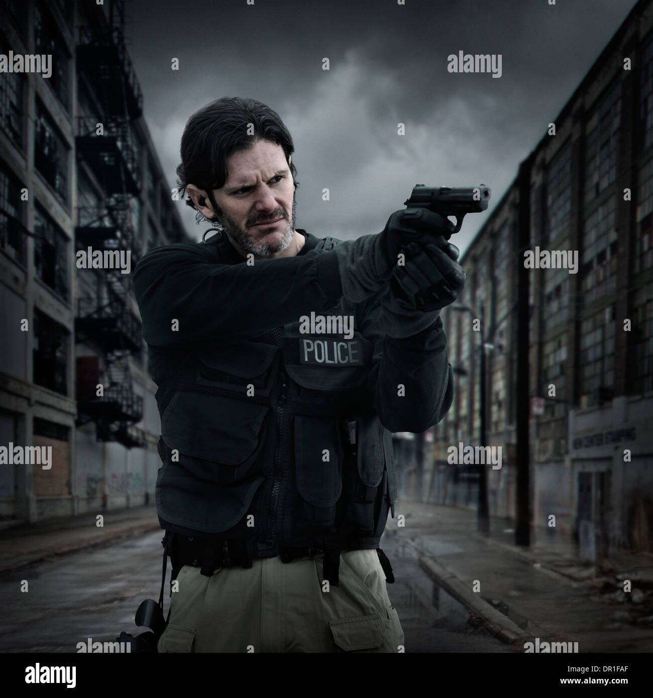 Policeman with gun hi-res stock photography and images - Alamy