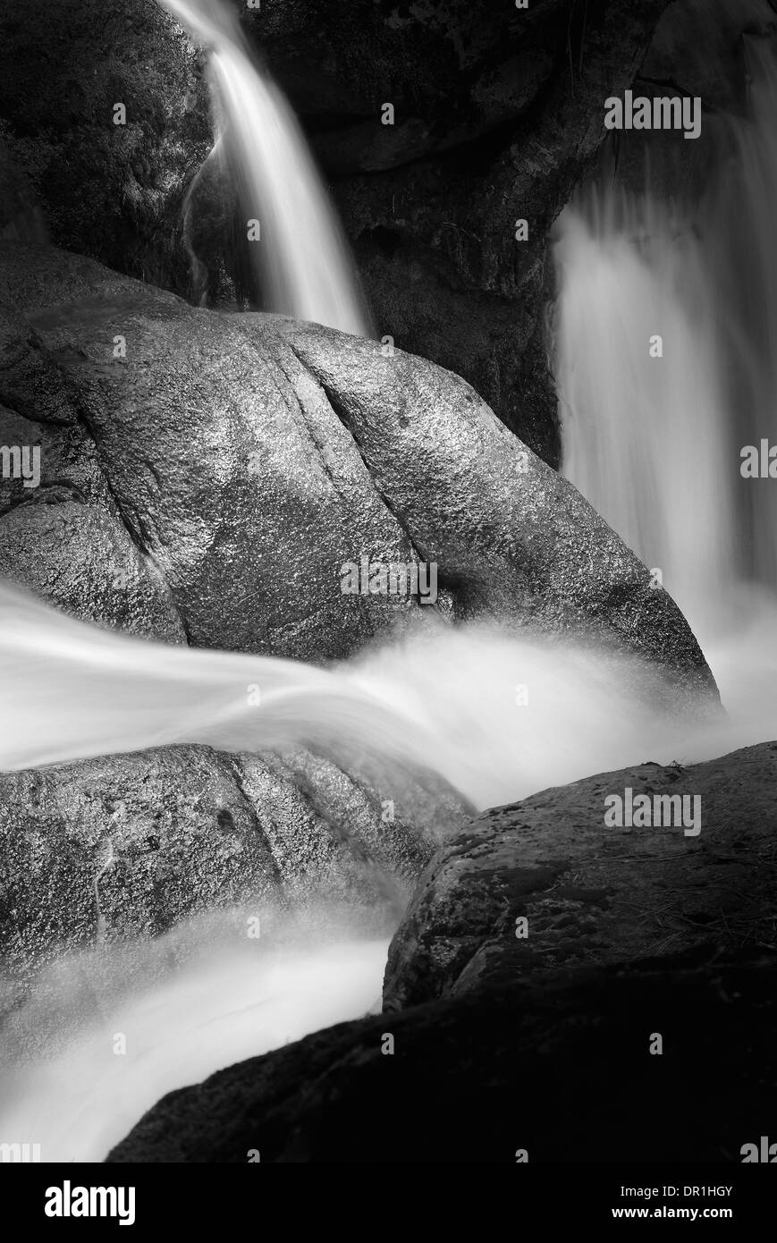 Water pouring over rock formations Stock Photo - Alamy