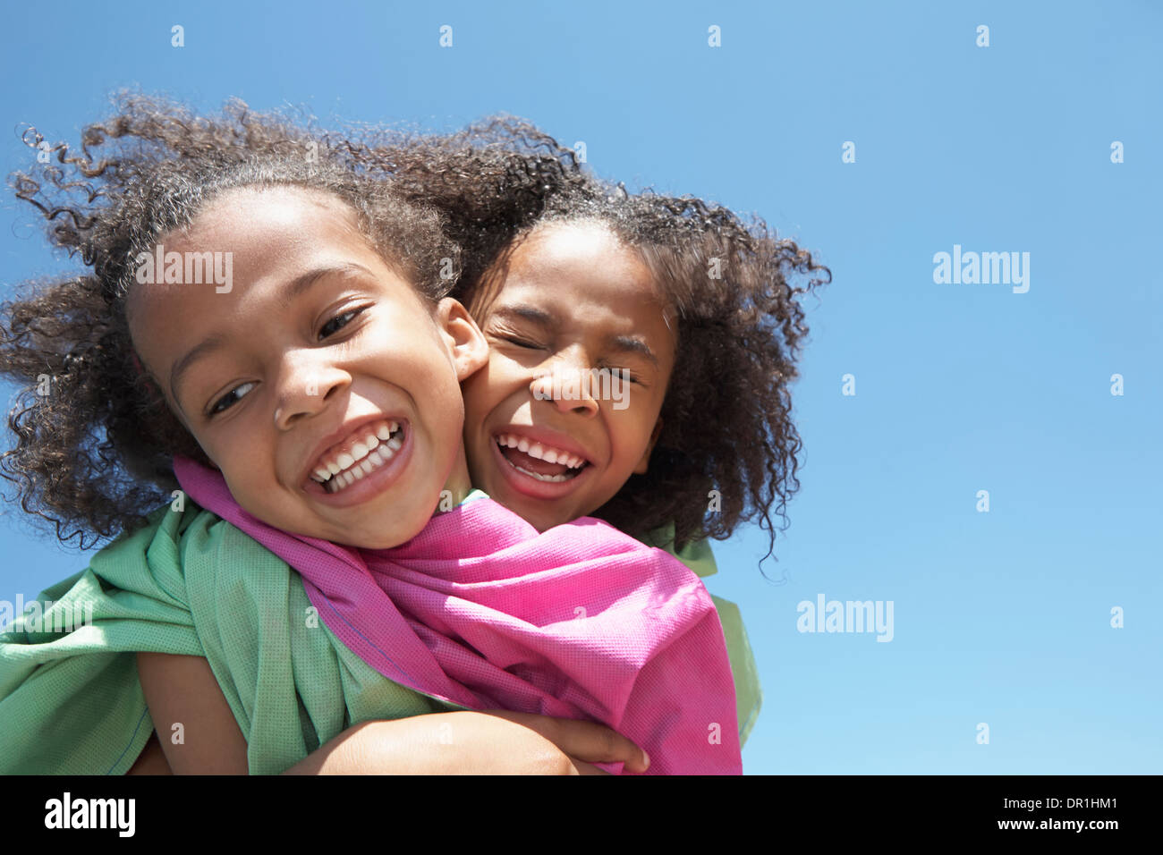 Girls playing together outdoors Stock Photo - Alamy