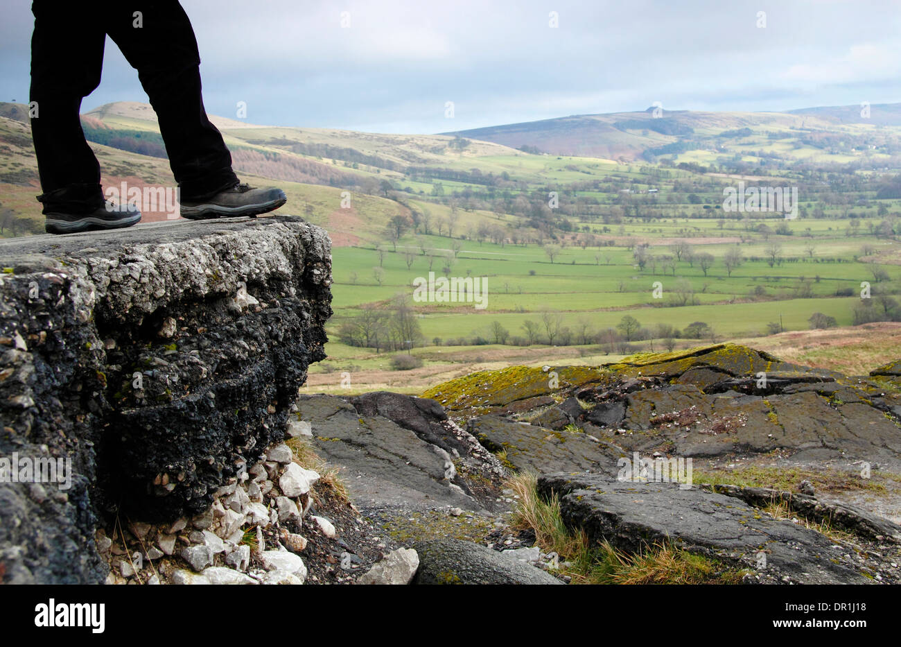 Man standing on the Mam Tor landslip above the Hope Valley at Castleton ...