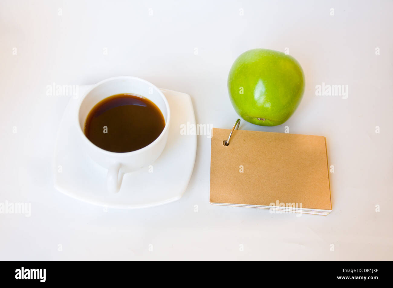 black coffee and green apple on white background Stock Photo - Alamy