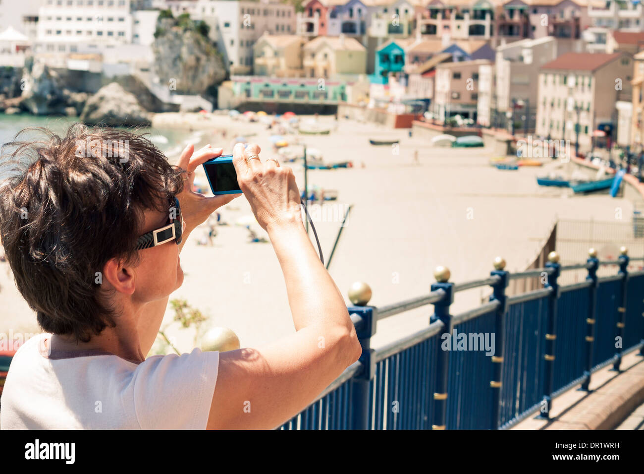 Tourist woman taking picture of Catalan bay, Gibraltar, UK Stock Photo ...